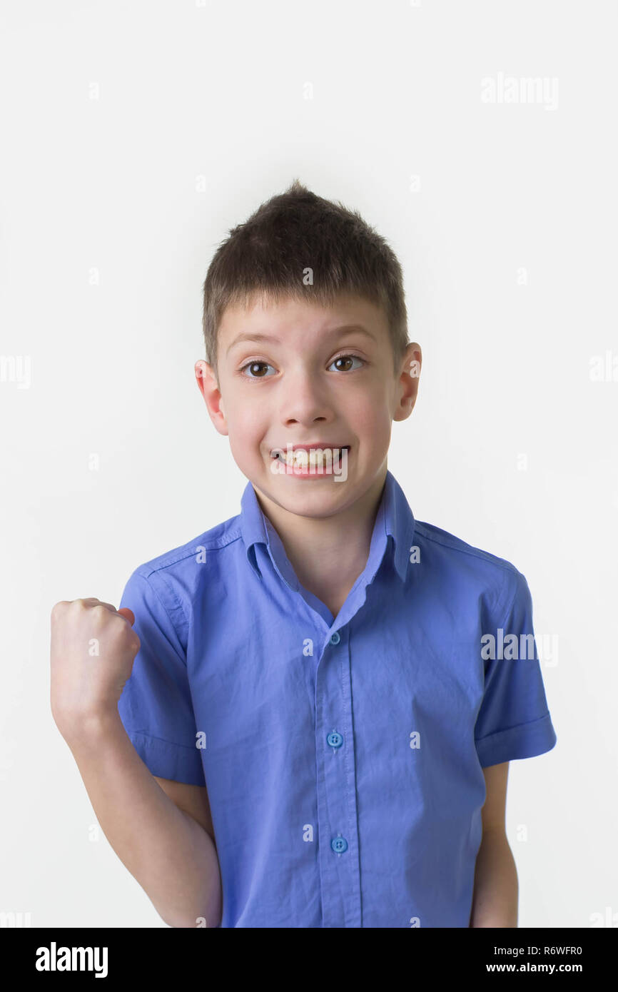 portrait of a handsome young teen boy winning over white background ...