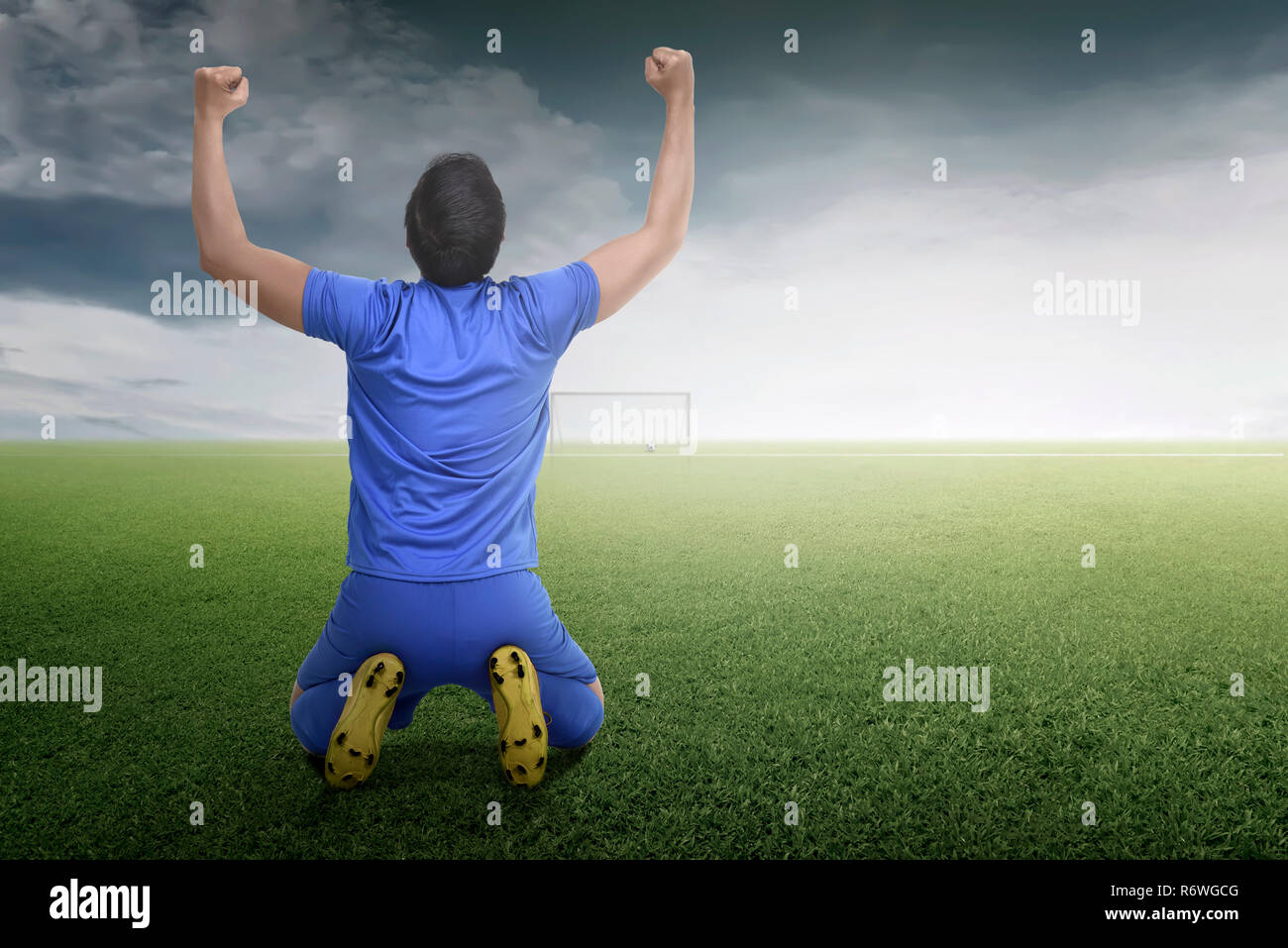 Back view of asian footballer man celebrate his goal Stock Photo - Alamy
