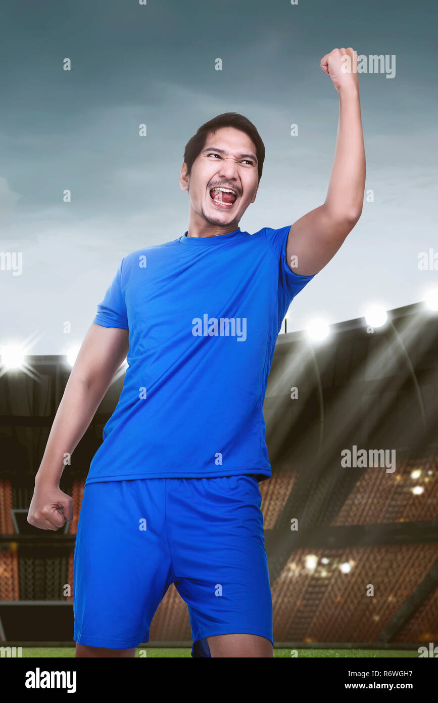 Young asian soccer player with excited expression Stock Photo - Alamy
