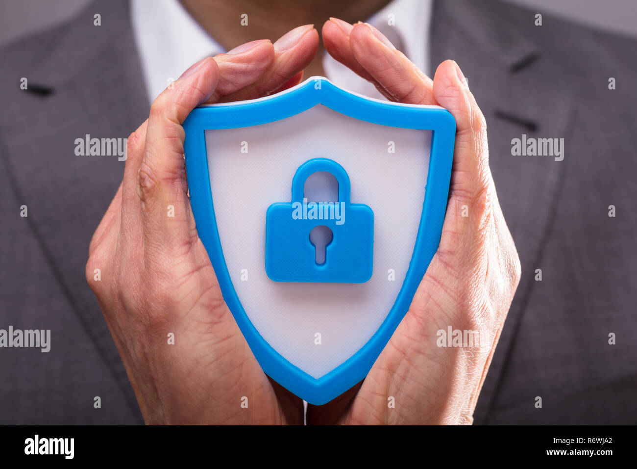 Holding shield hi-res stock photography and images - Alamy