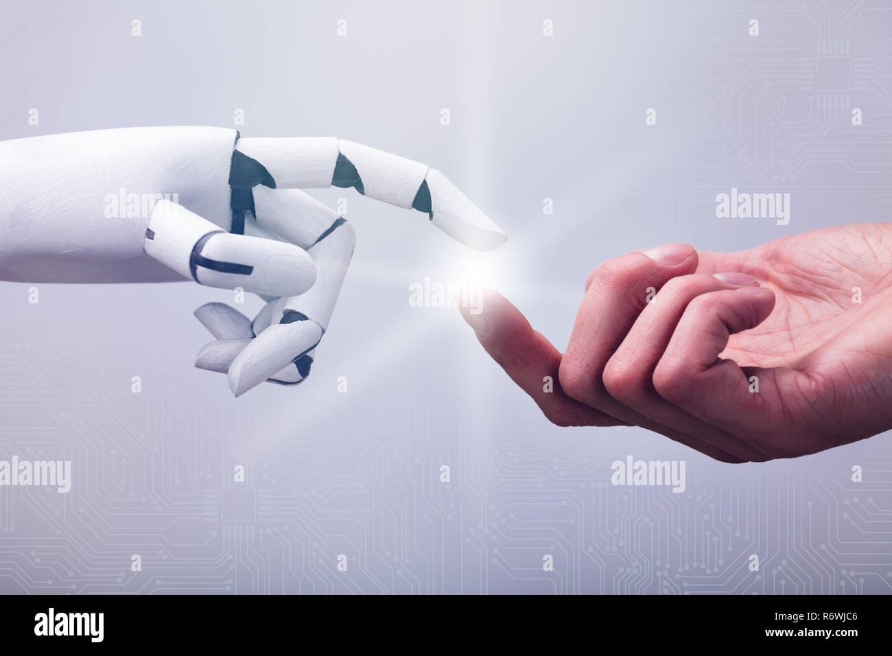 Robot Touching Human Finger Stock Photo - Alamy