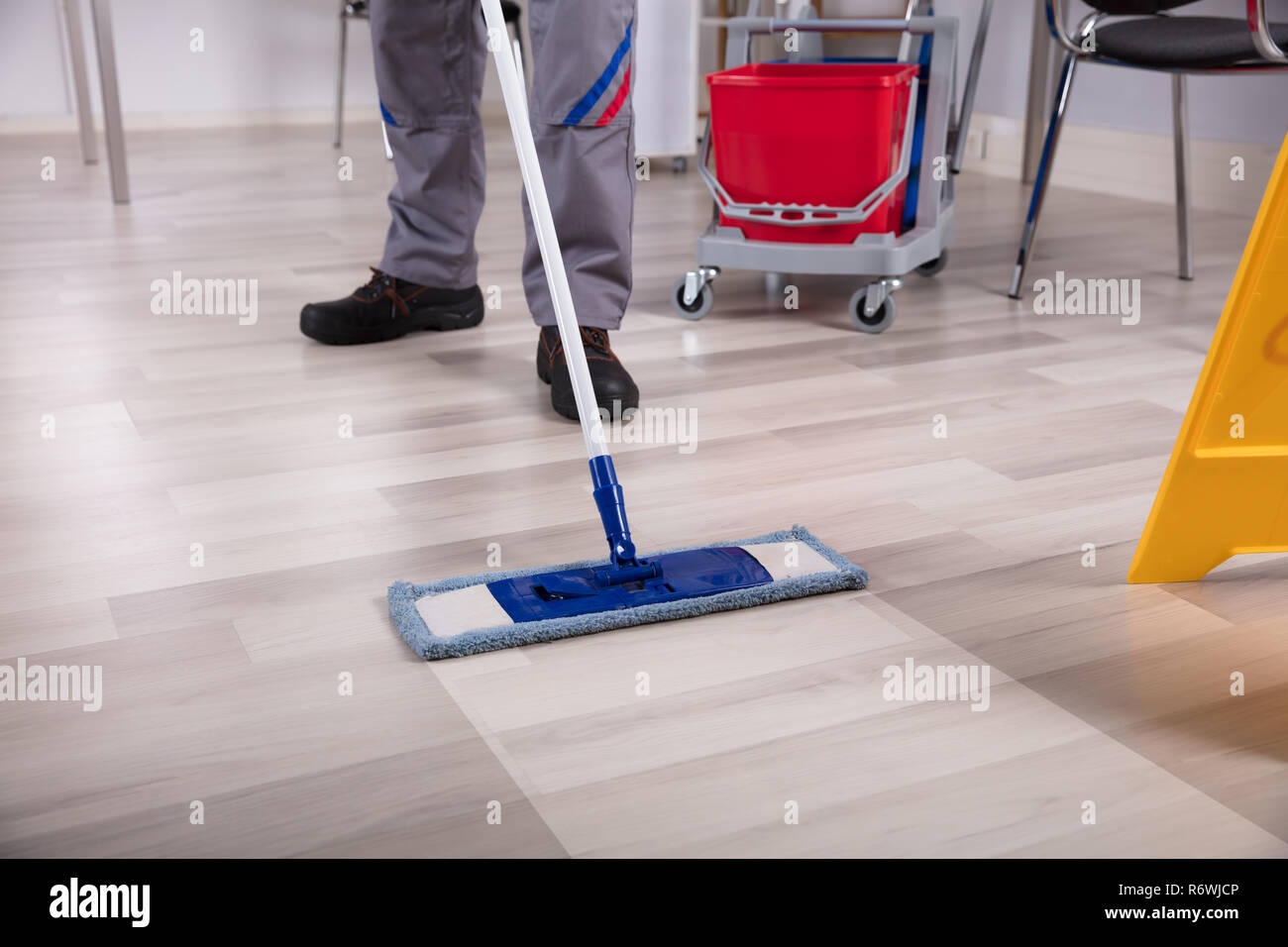 Cleaner Cleaning Floor With Mop Stock Photo - Alamy