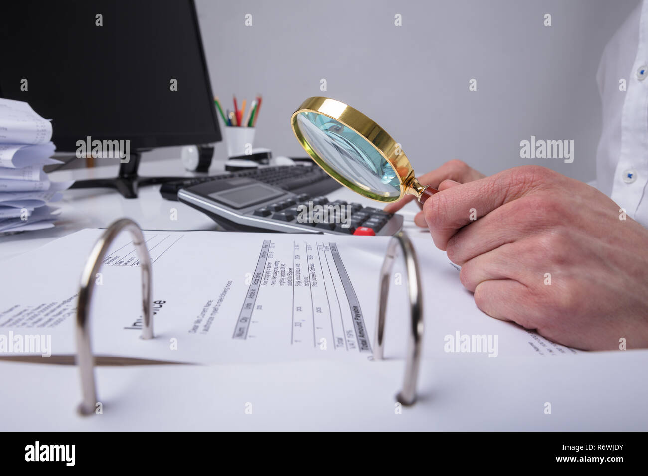 Businessman using magnifying glass analyzing hi-res stock photography ...