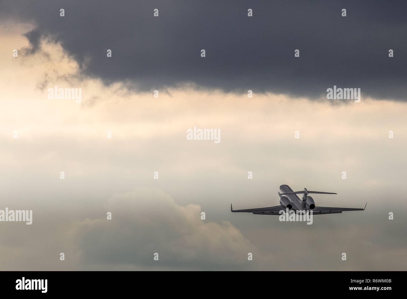 An executive business jet aeroplane taking off and heading out in to ...