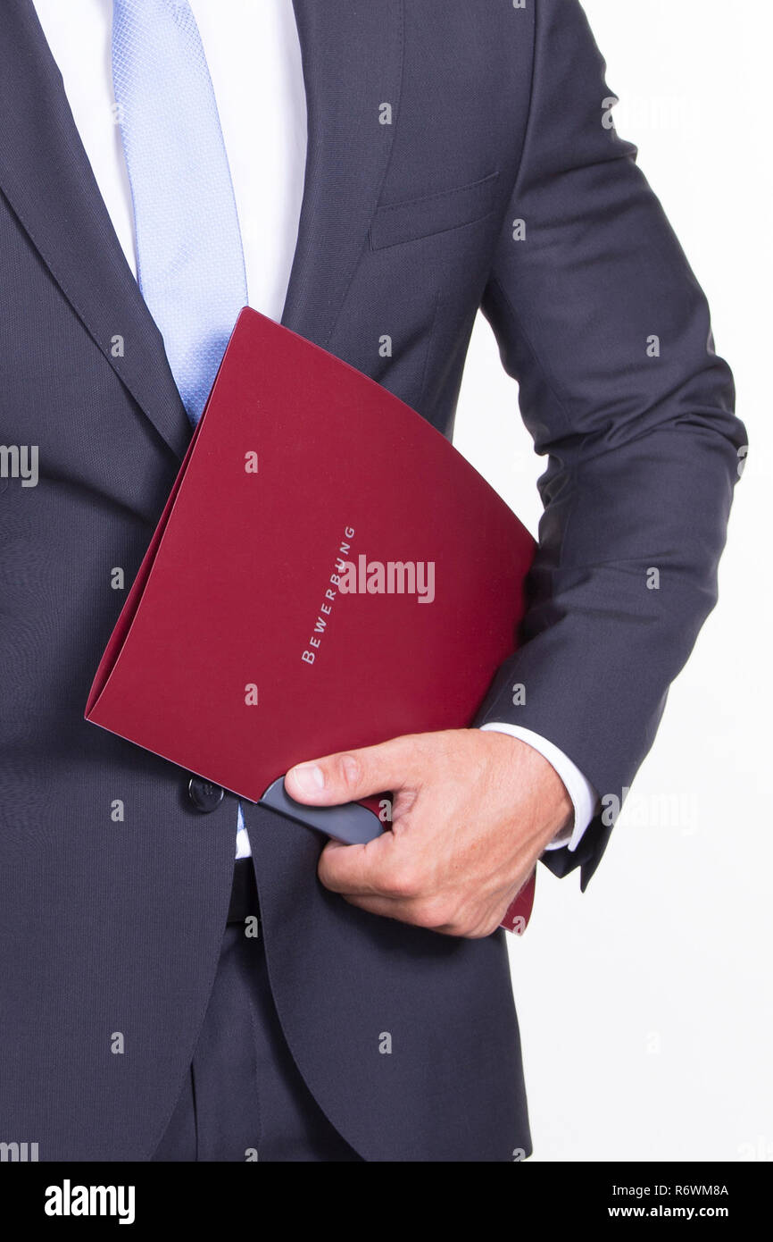 man in suit with application binder Stock Photo - Alamy