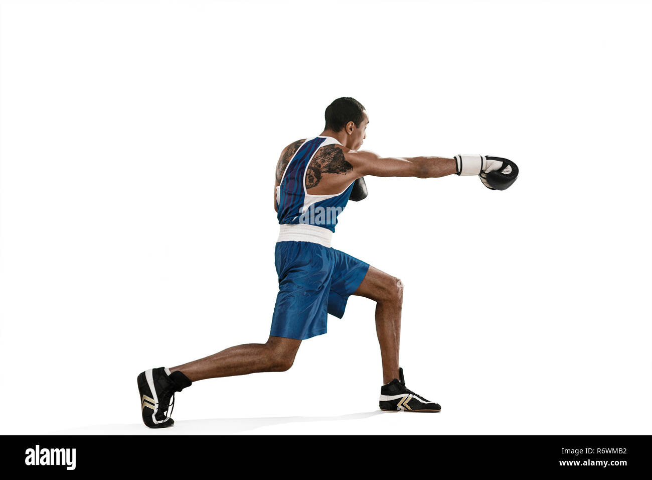 Sporty man during boxing exercise making hit. Photo of boxer on white ...