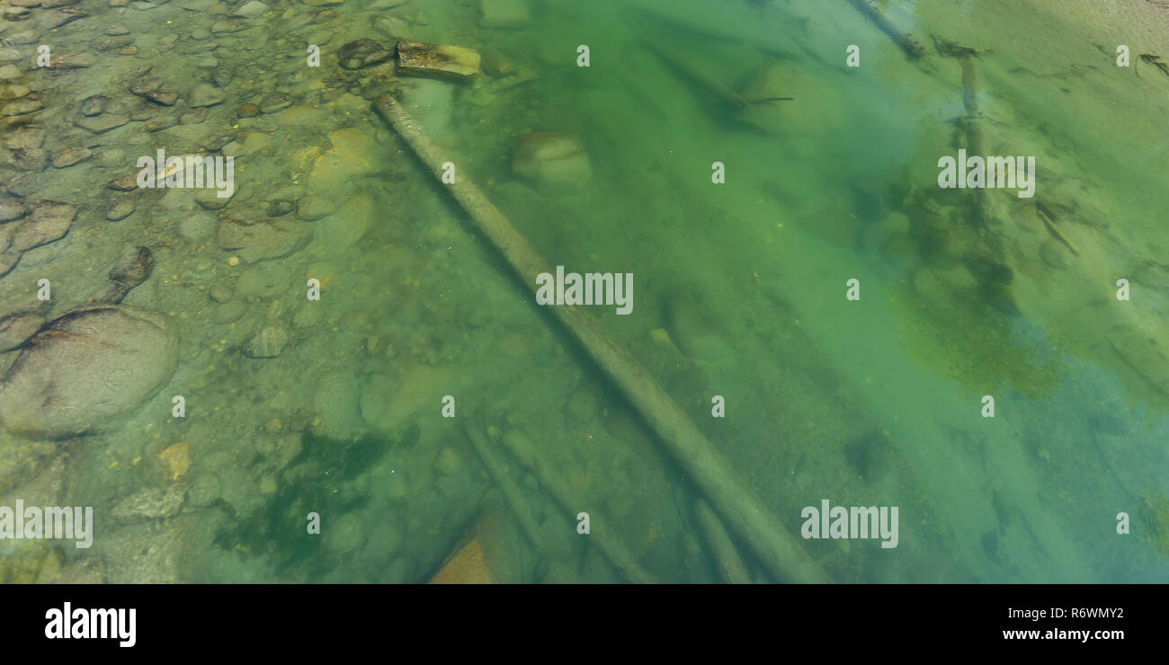 Wenatchee River with rocks and pole at the bottom Stock Photo - Alamy