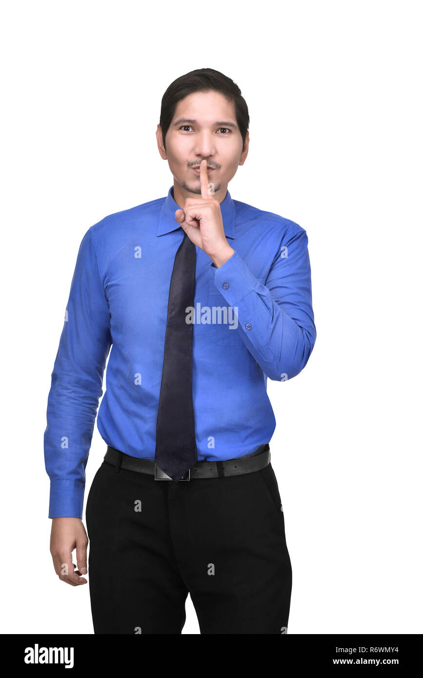 Serious male with silence hand gesture hi-res stock photography and ...