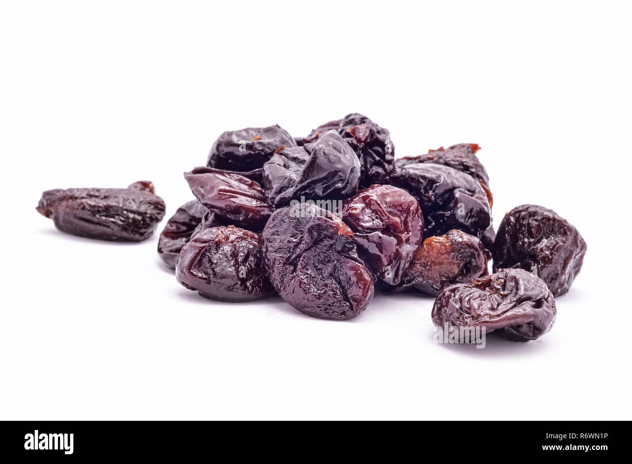 Naturally sweet dried plums on a clean white background, healthy ...