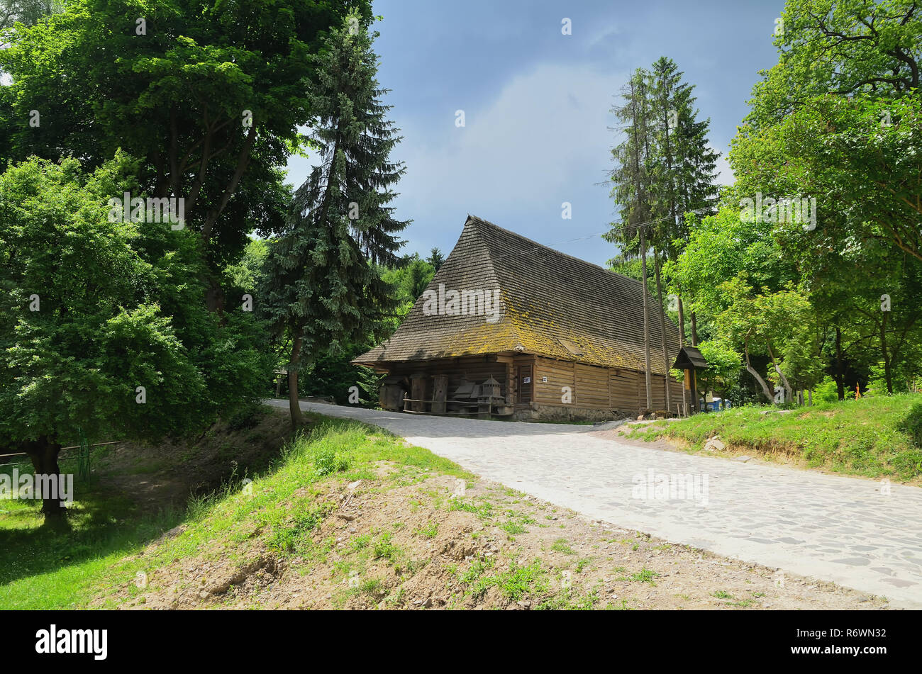 A large wooden building made of wooden beams Stock Photo - Alamy