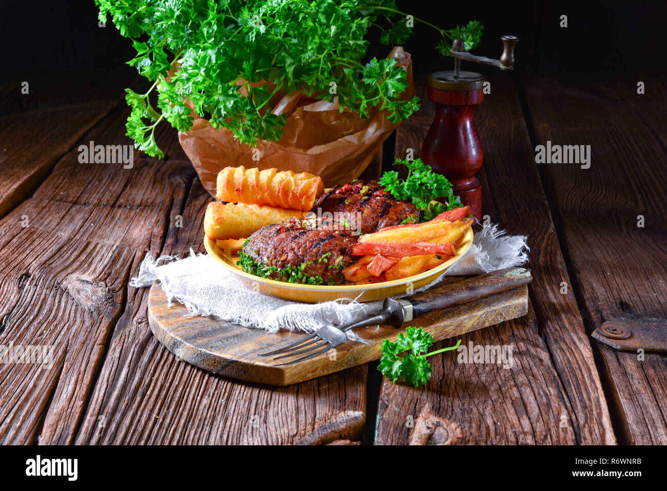 grilled bullets with croquettes and vegetables Stock Photo - Alamy