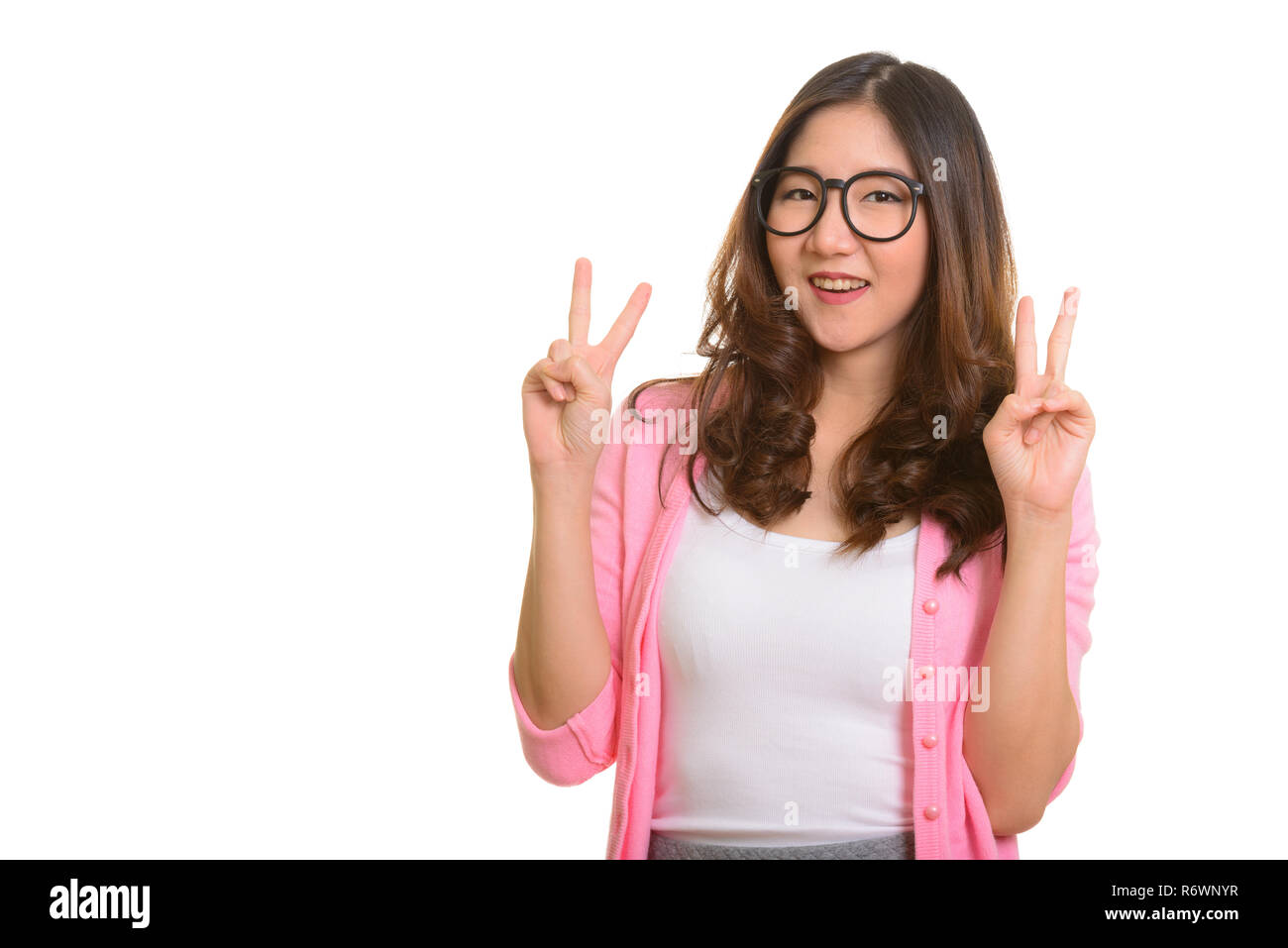 Woman giving peace sign hi-res stock photography and images - Alamy