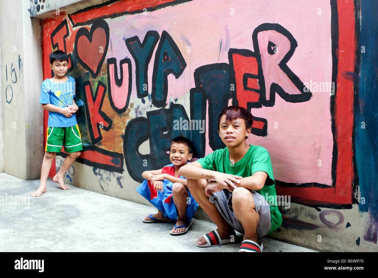 Street kids children in front of a graffiti wall at the Kuya Center for ...