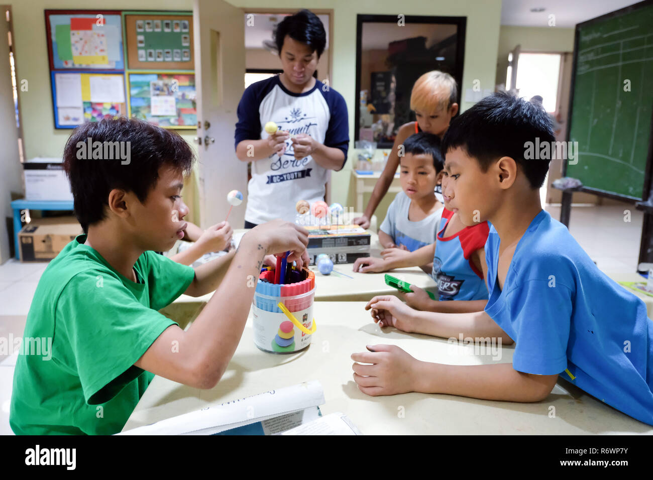 Street kids play and learn at the Kuya Center Street Child ...