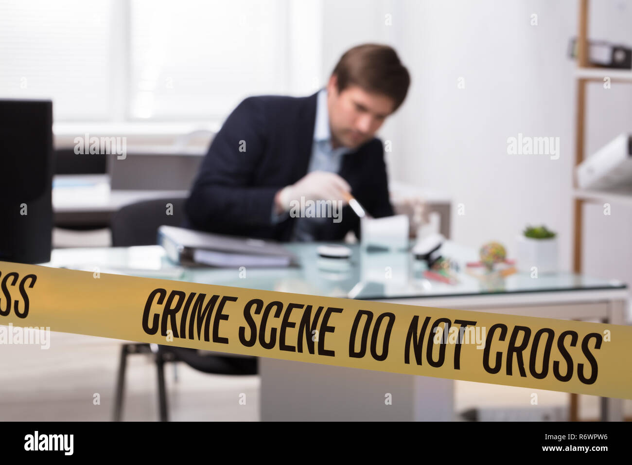 Forensic Expert Searching For Crime Evidence Stock Photo - Alamy