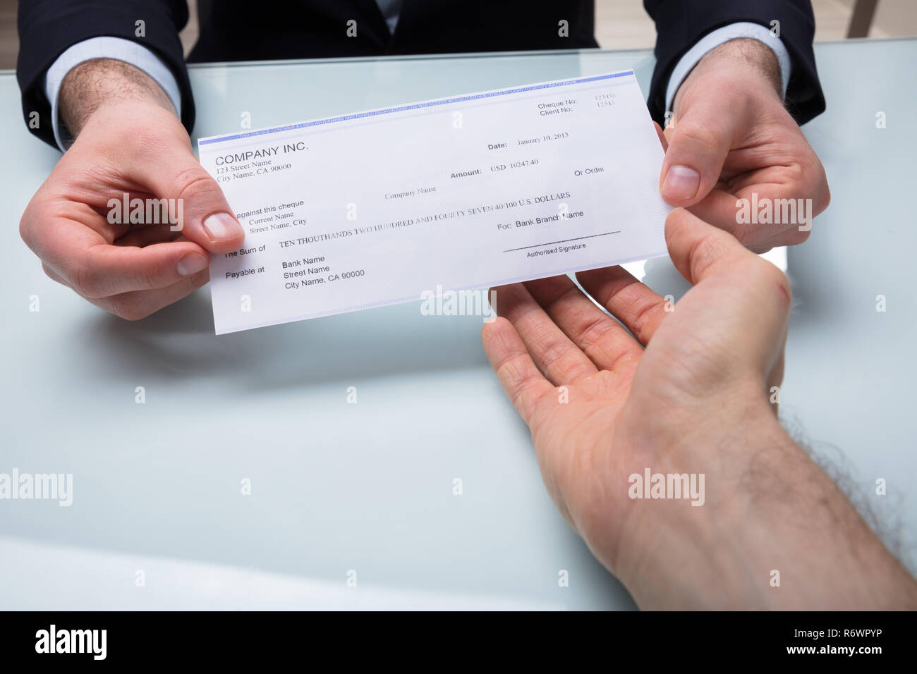 Giving cheque hi-res stock photography and images - Alamy