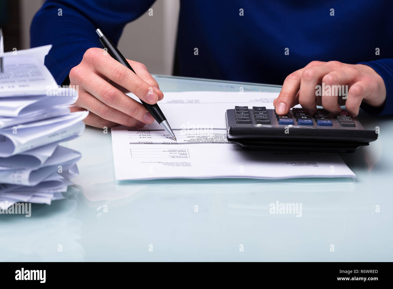 Businessperson checking bill calculator hi-res stock photography and ...