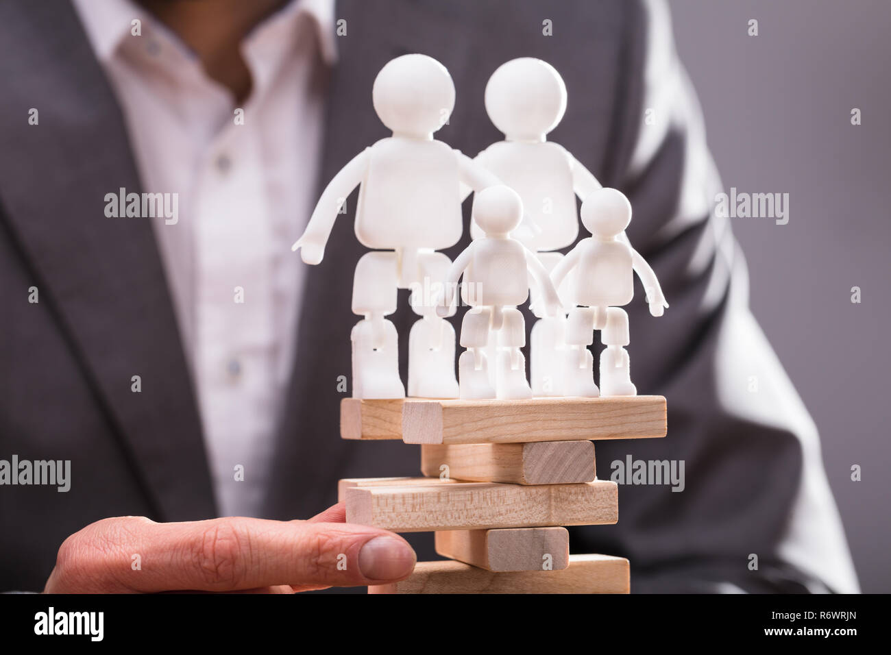 Human Hand Arranging Wooden Blocks Stock Photo - Alamy