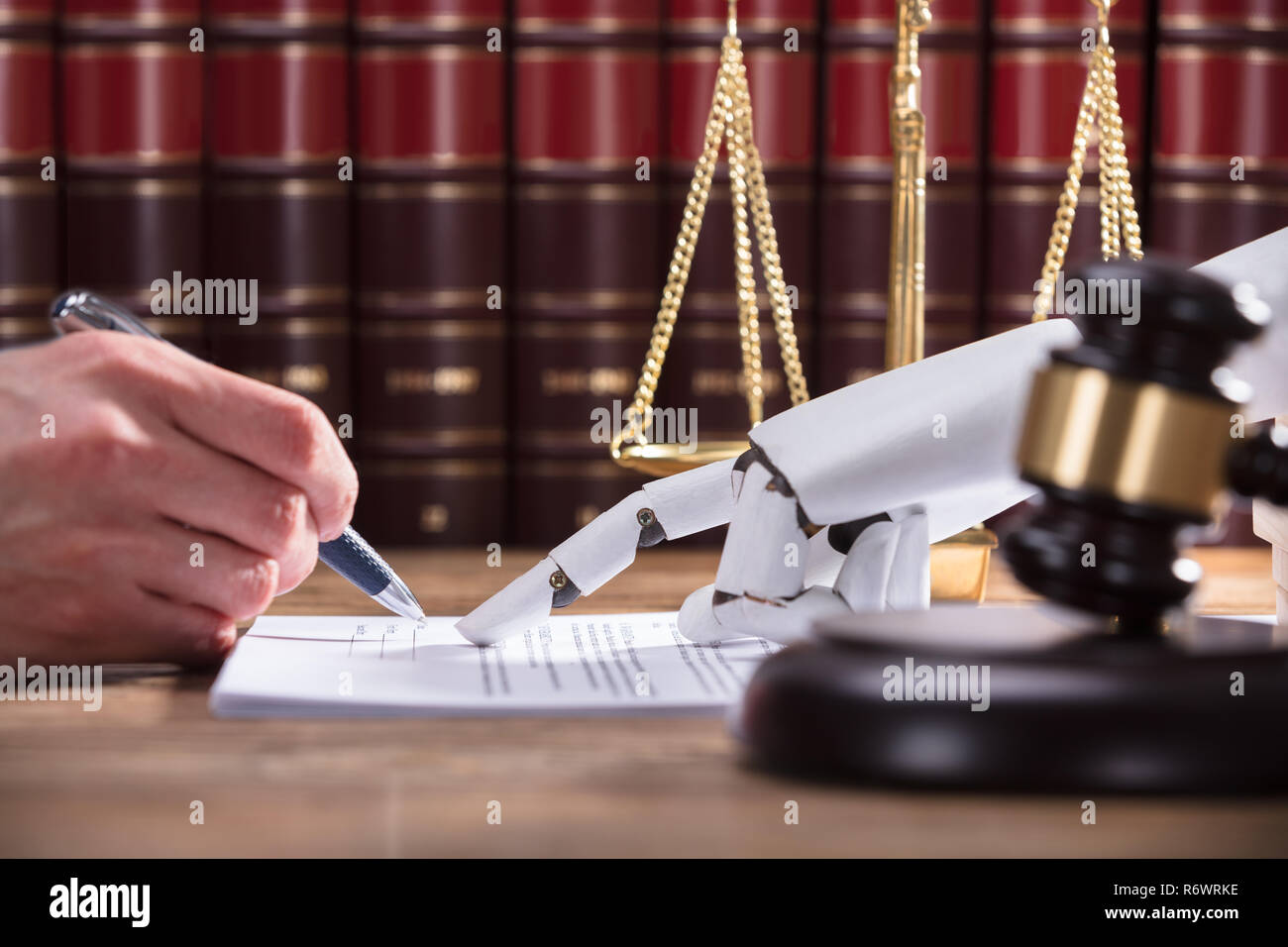 Robot Assisting Person In Filling Form Stock Photo - Alamy