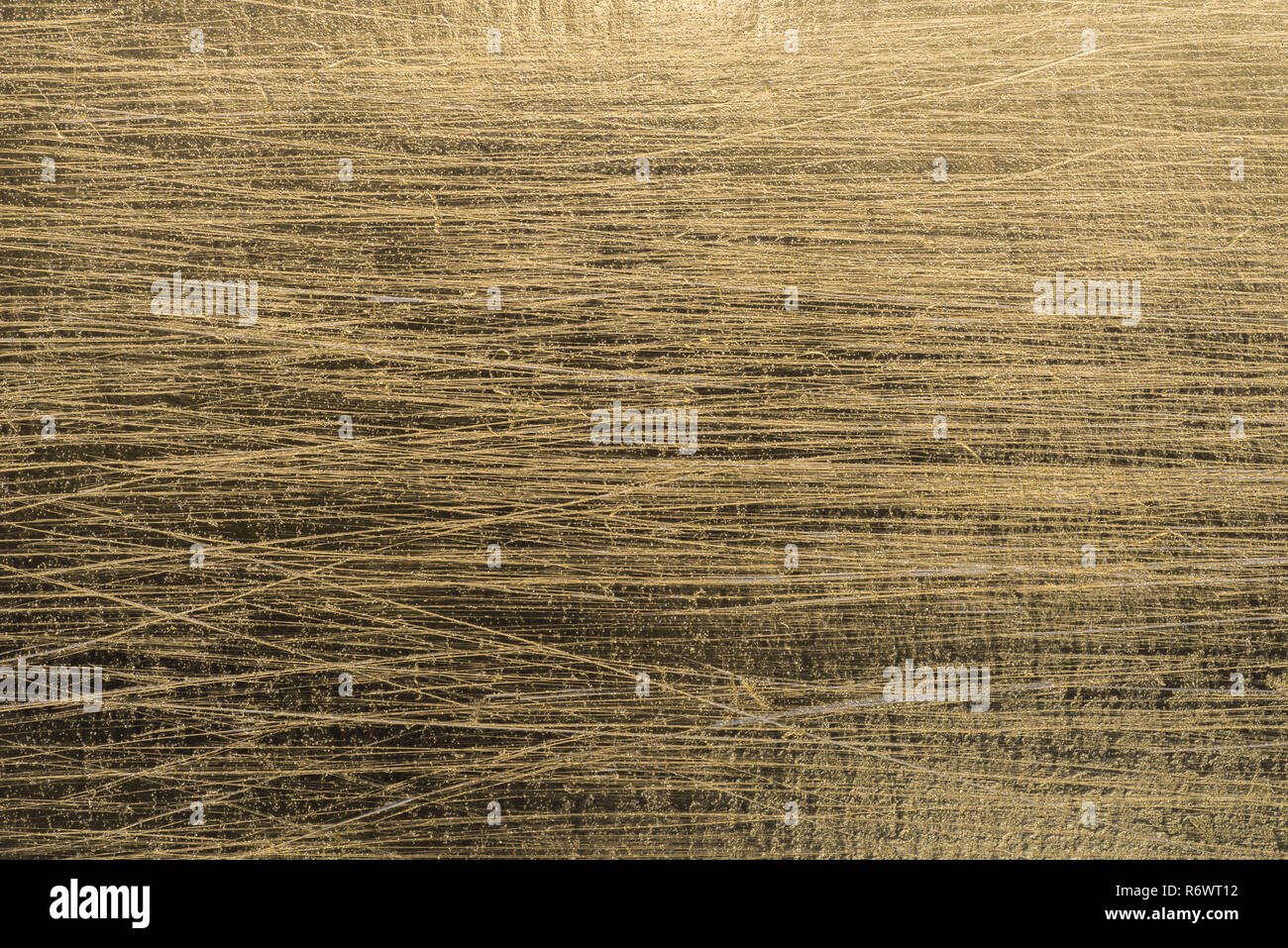 gold color scratched metallic paper background texture Stock Photo - Alamy