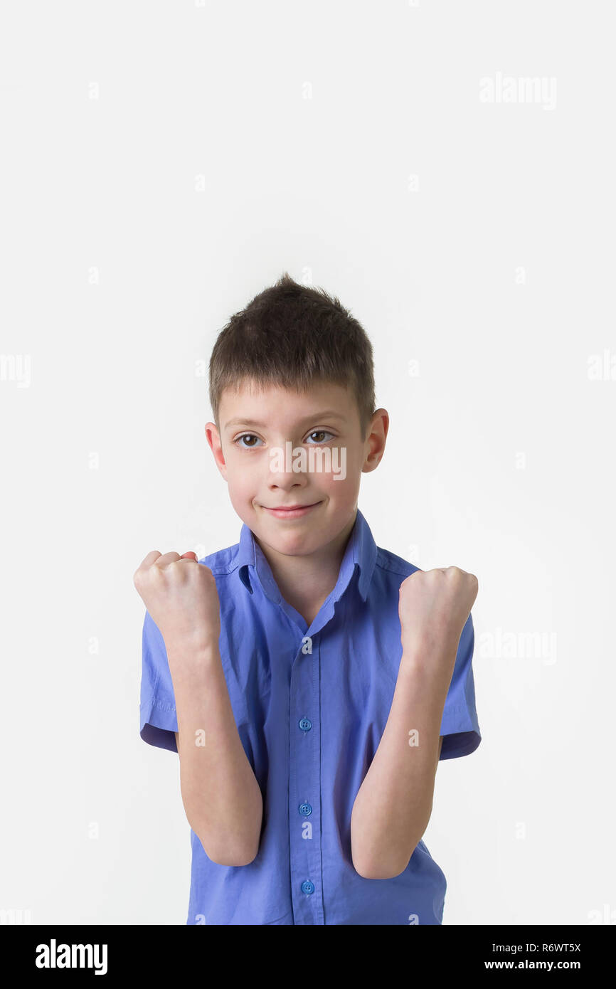 portrait of a handsome young teen boy winning over white background ...