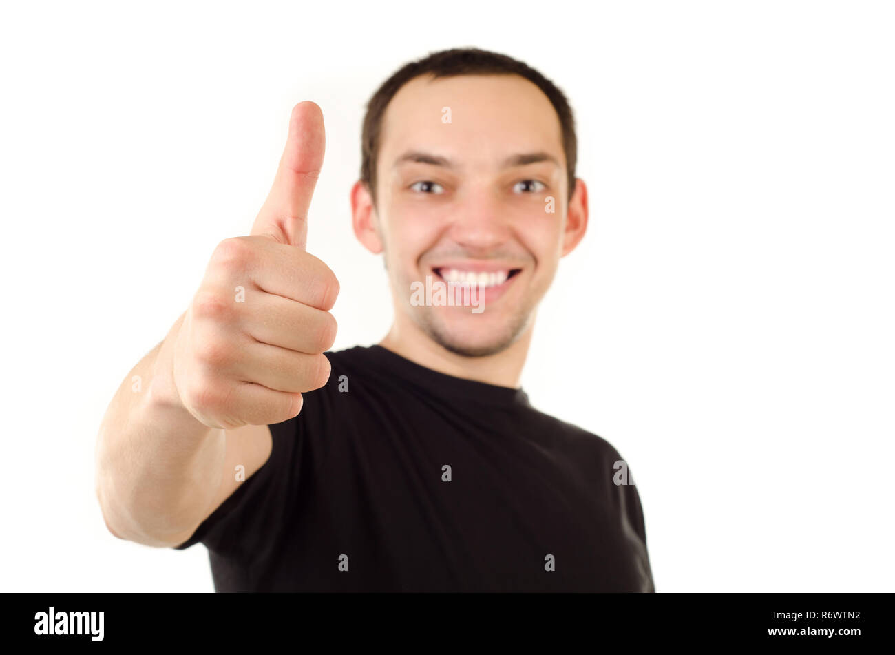 young man showing thumb up isolated on white Stock Photo - Alamy