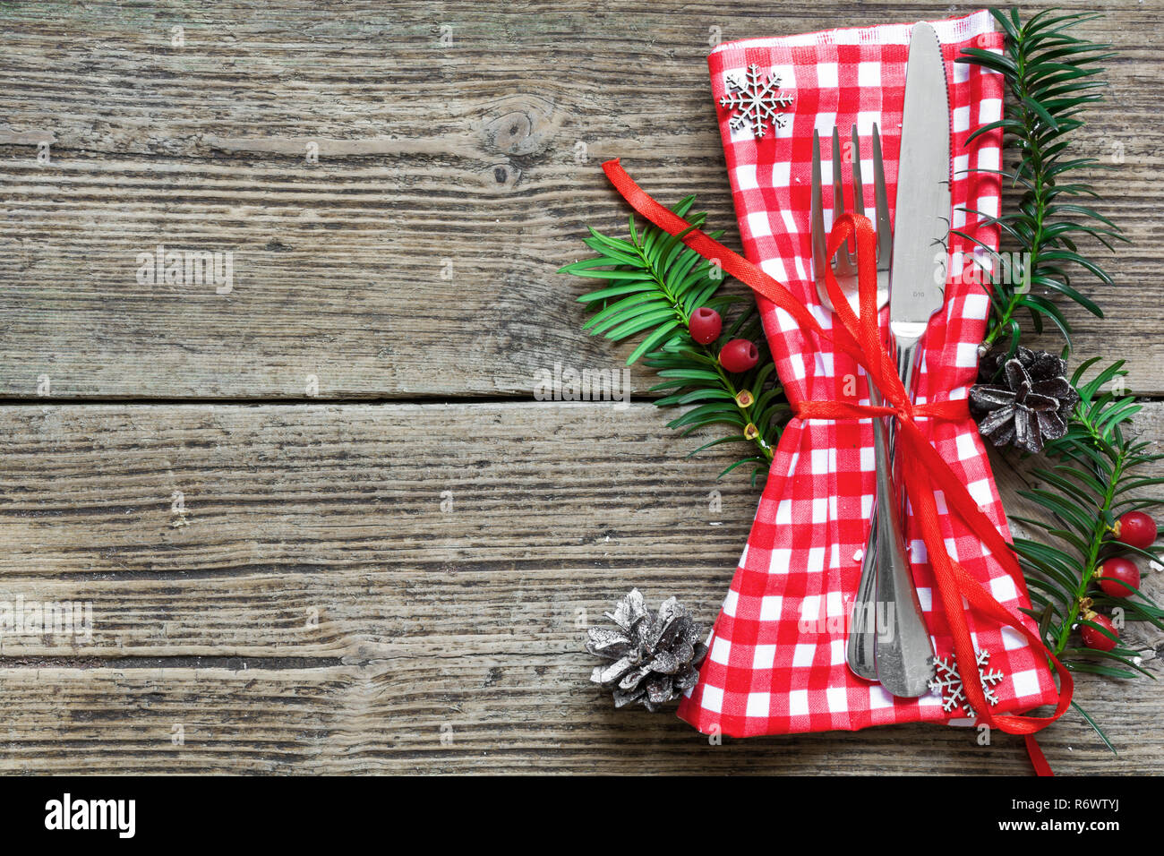 Christmas table place setting with christmas pine branches,ribbon and ...