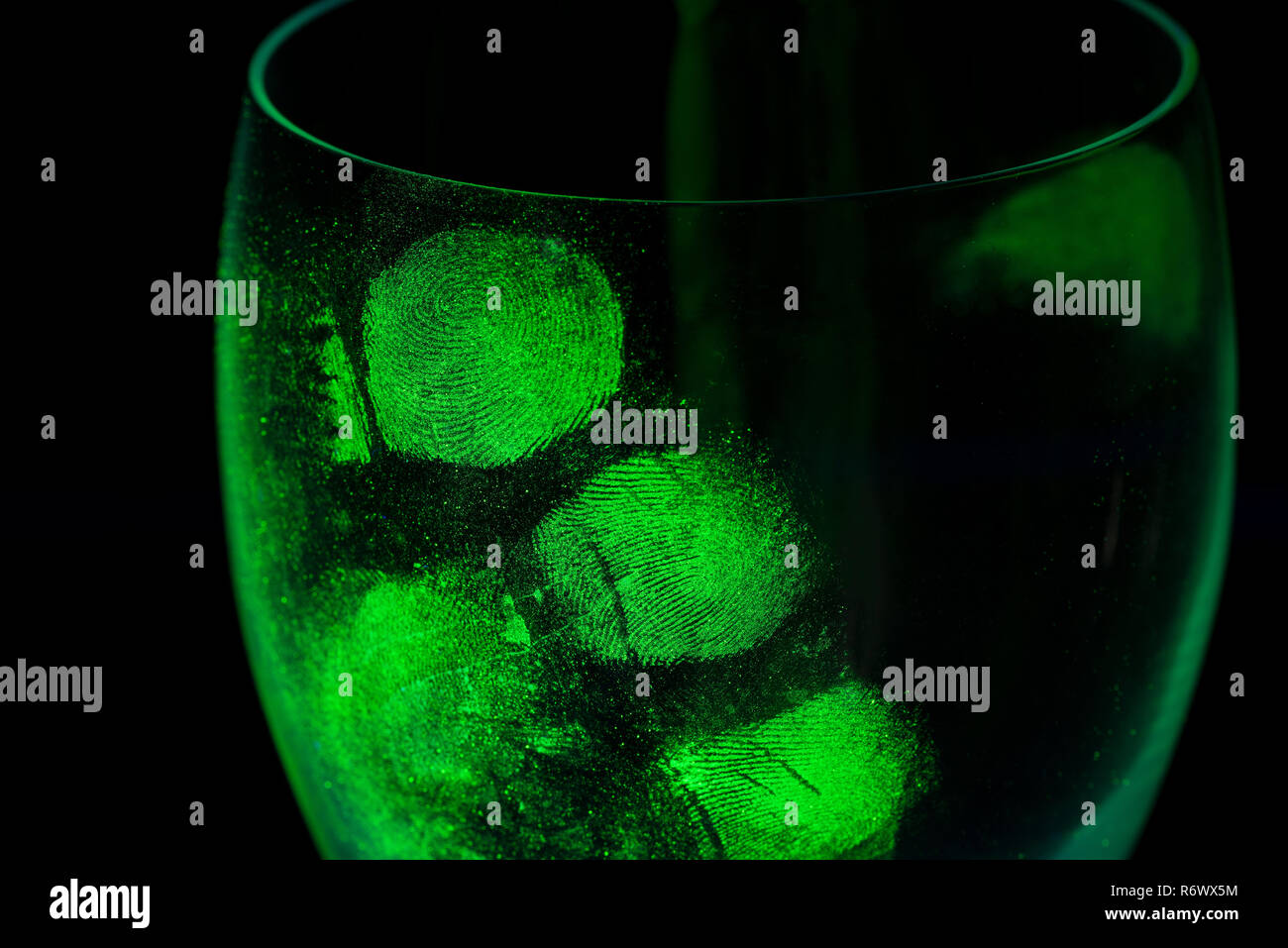 Thumb print fingerprints on wine glass showing up under blacklight ...