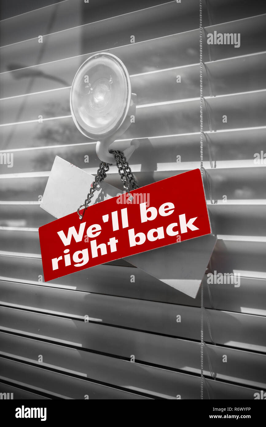 Sign Saying We ll Be Right Back On A Glass Door Stock Photo Alamy