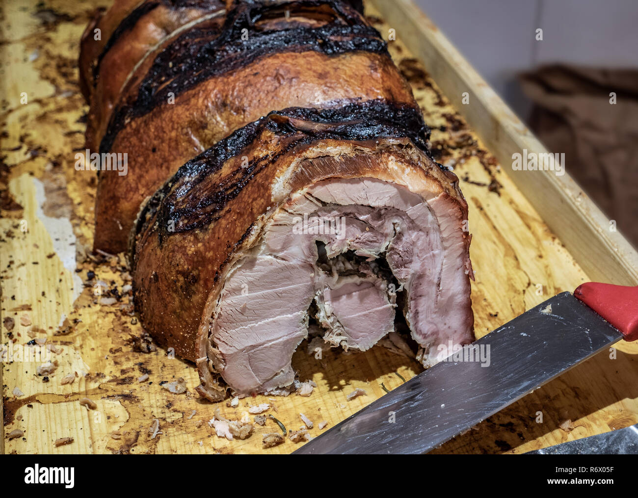 porchetta: stuffed pork, cooked on the spit without bones Stock Photo ...