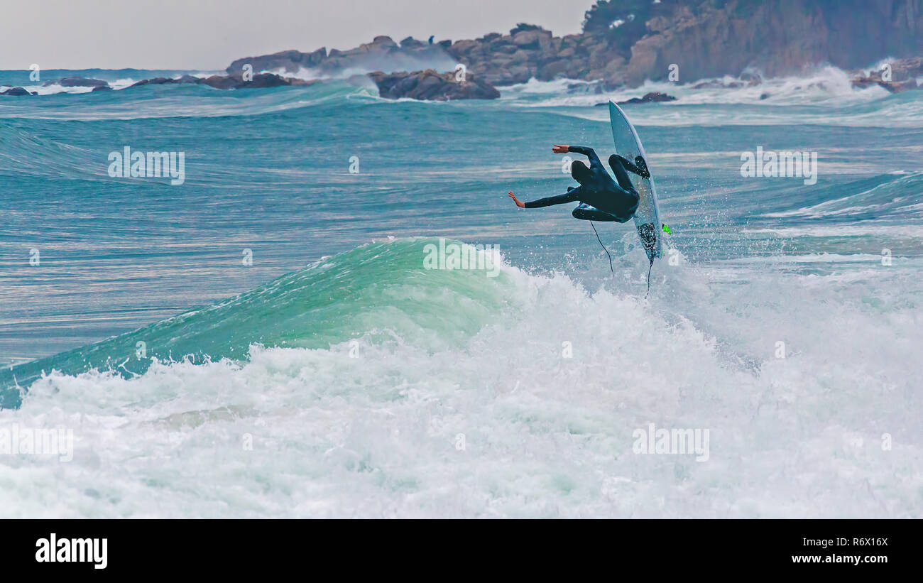 Surfer jumping on the big wave sport Stock Photo - Alamy