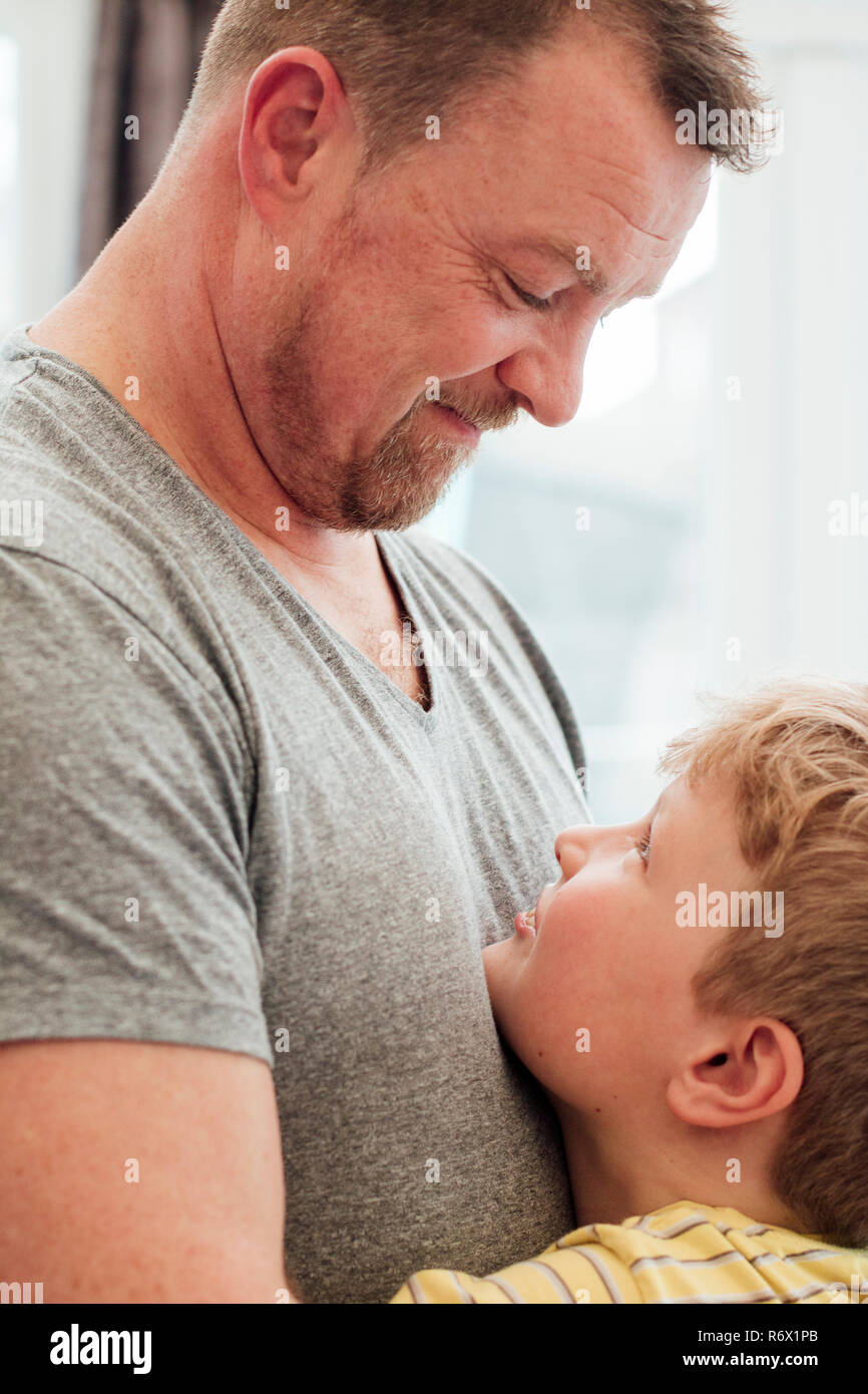 Bonding with Dad at Home Stock Photo - Alamy