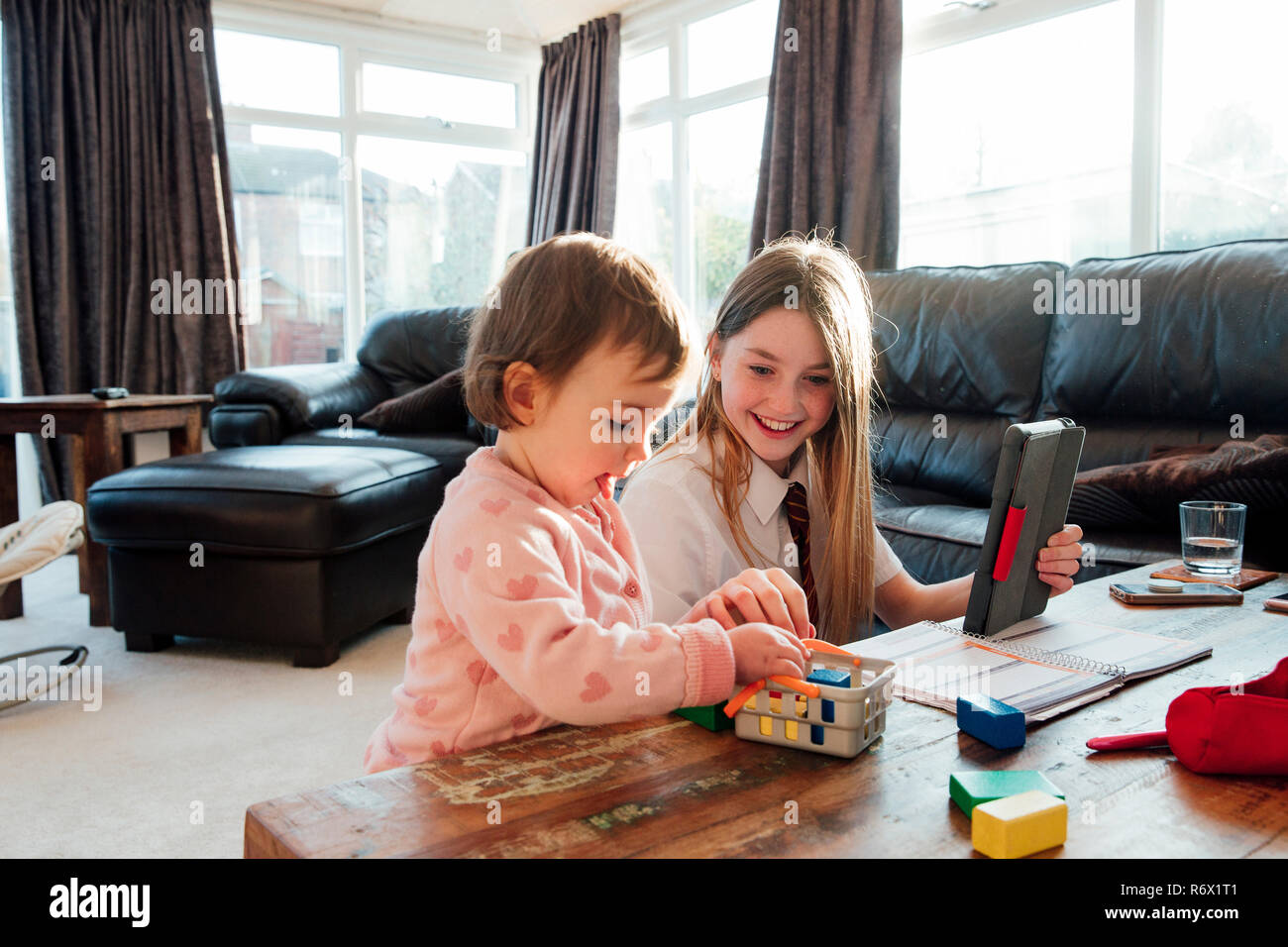 Multitasking Siblings and Study Stock Photo - Alamy