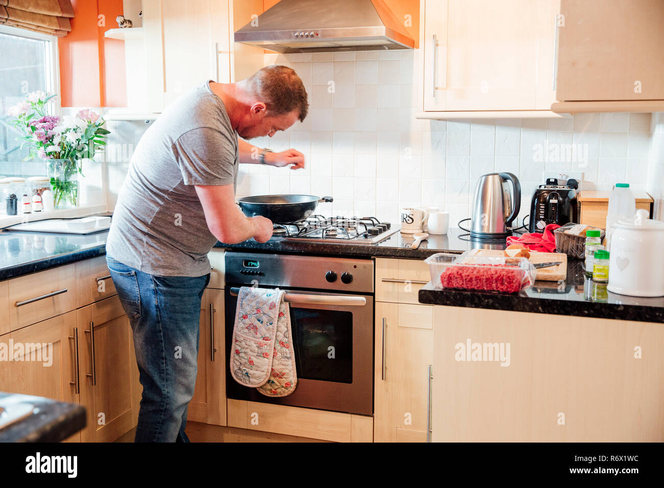 Man Cooking in his Kitchen Stock Photo - Alamy