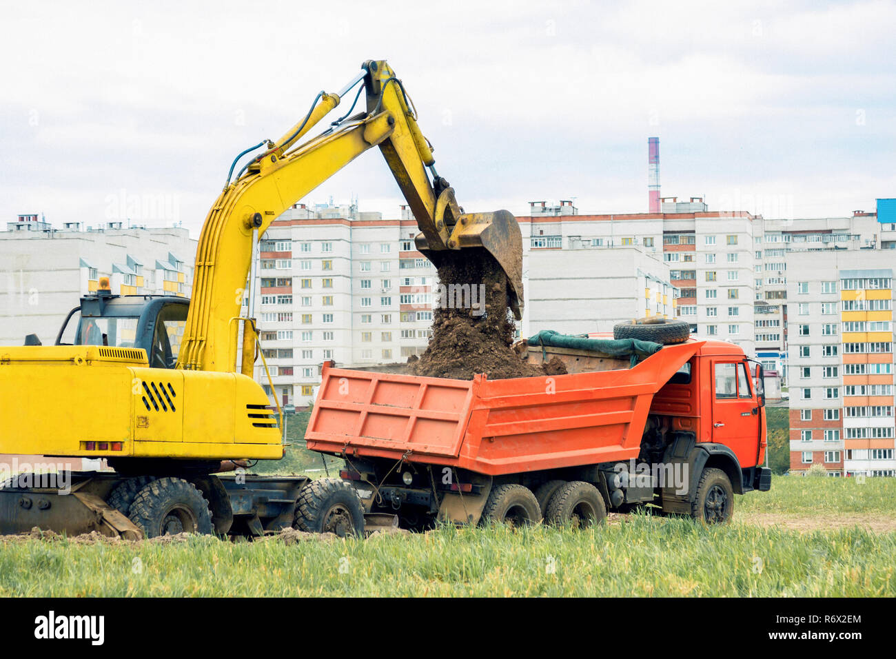 Excavator loading dump truck soil hi-res stock photography and images ...