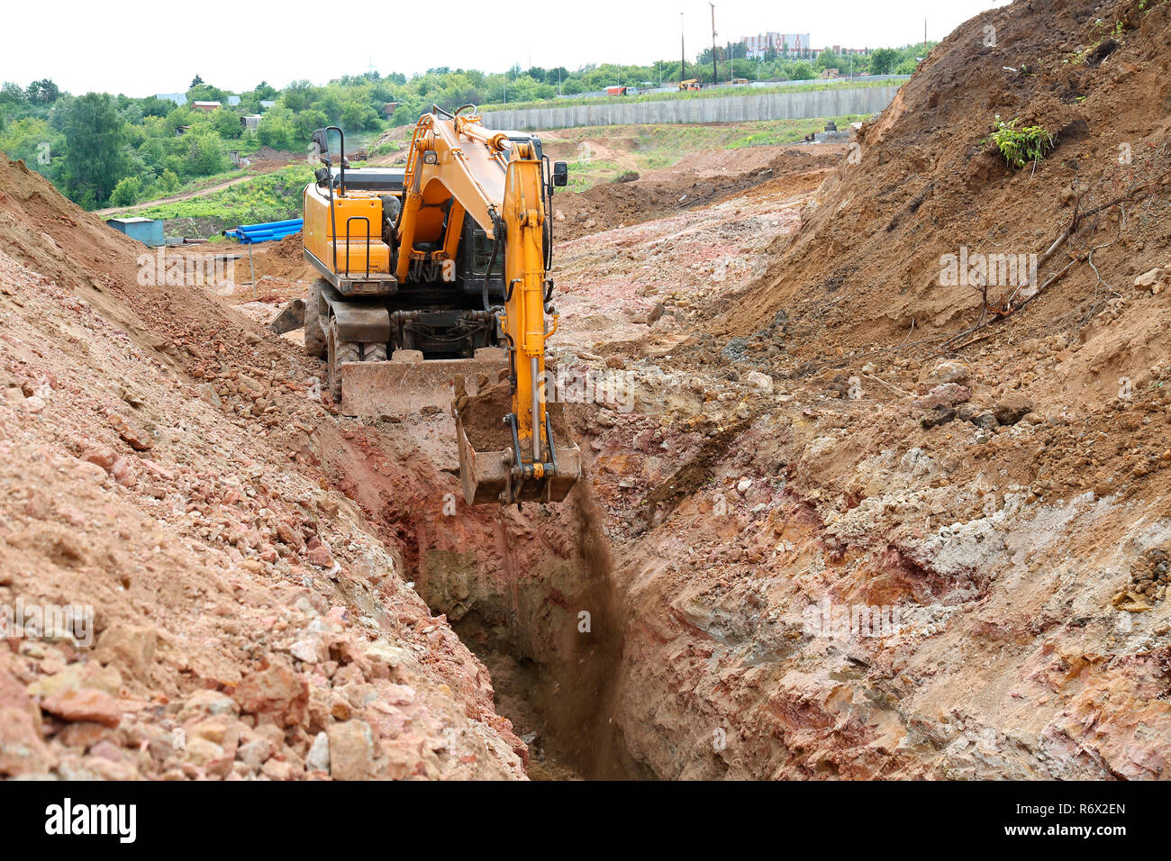 Excavator digging a trench for the pipeline. Excavation Stock Photo - Alamy Excavator digging a trench for the pipeline. Excavation Stock Photo - Alamy