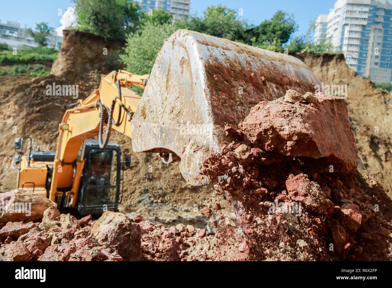 Excavator work at a construction site. Bucket closeup Stock Photo - Alamy
