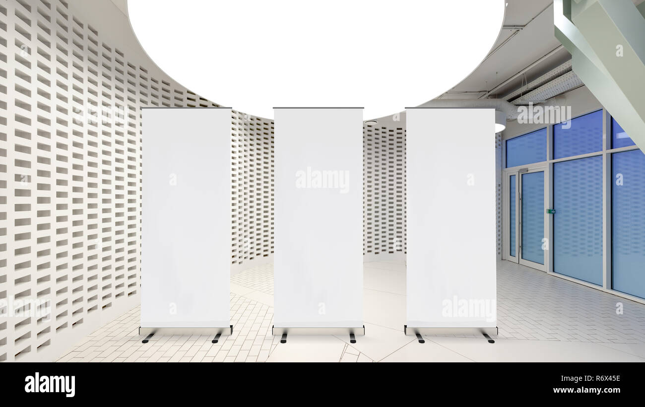 Three blank roll up banner stand in contemporary office interior with ...