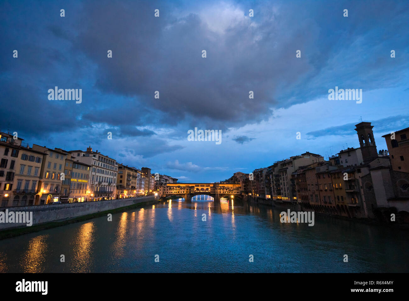 Horizontal view of the Ponte Vecchio lit up at night in Florence, Italy ...