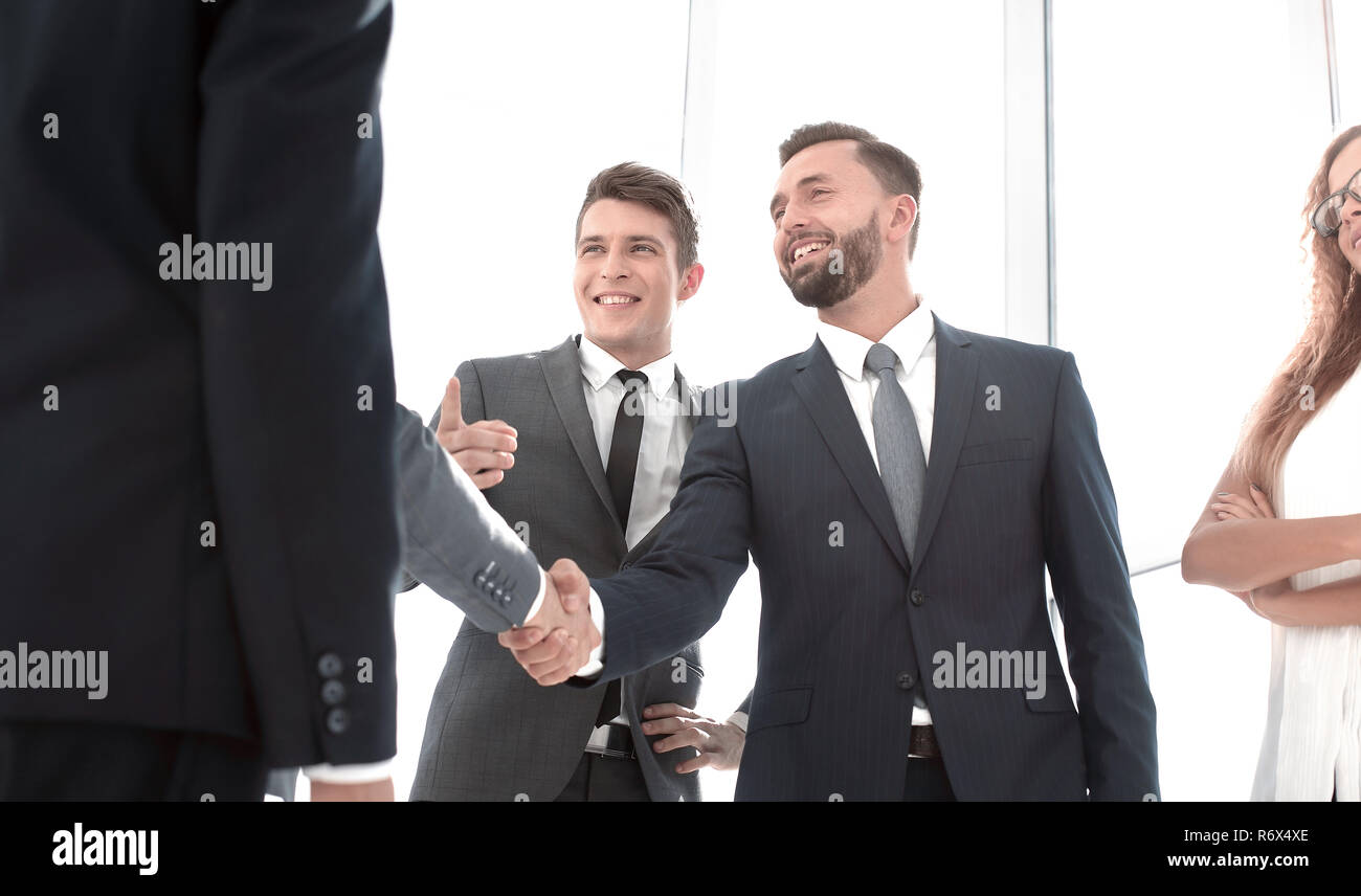 handshake of young business partners in the office Stock Photo - Alamy