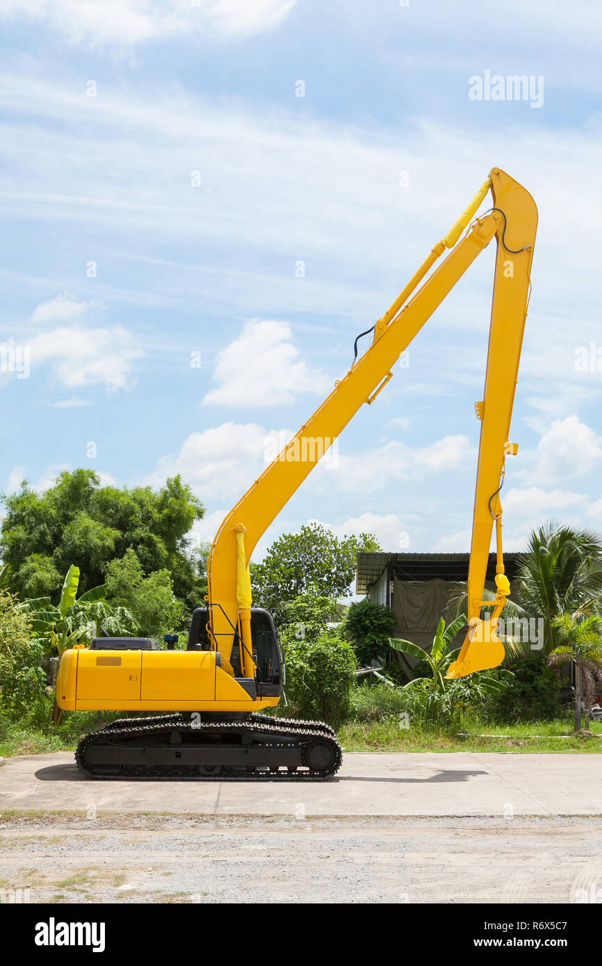 Hydraulic Yellow Excavator side view on outdoor location Stock Photo ...