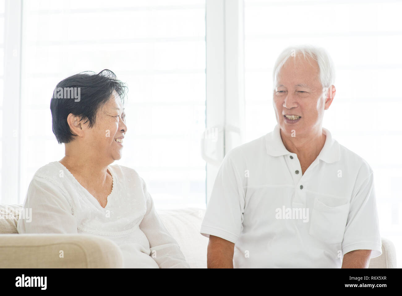 Old couple talking at home Stock Photo - Alamy