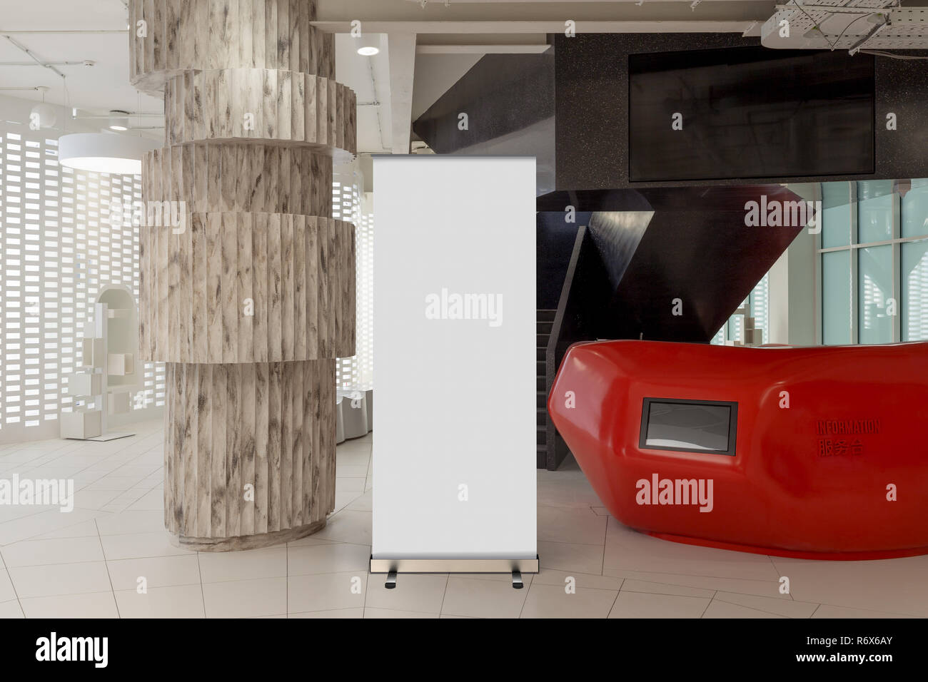 Blank roll up banner stand in office interior with reception desk and ...