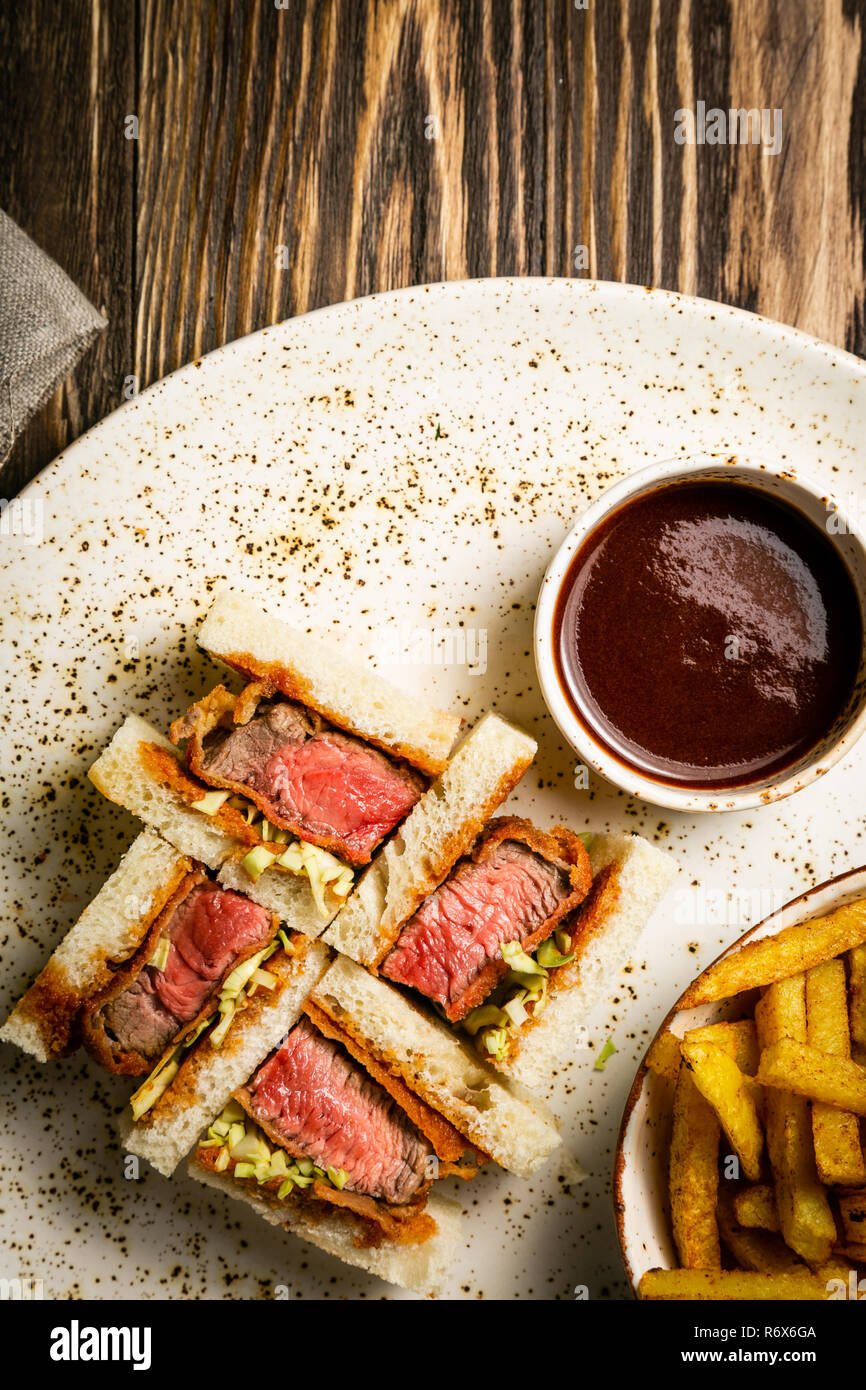 Katsu Sando - food trend japanese sandwich with pork and fries Stock ...