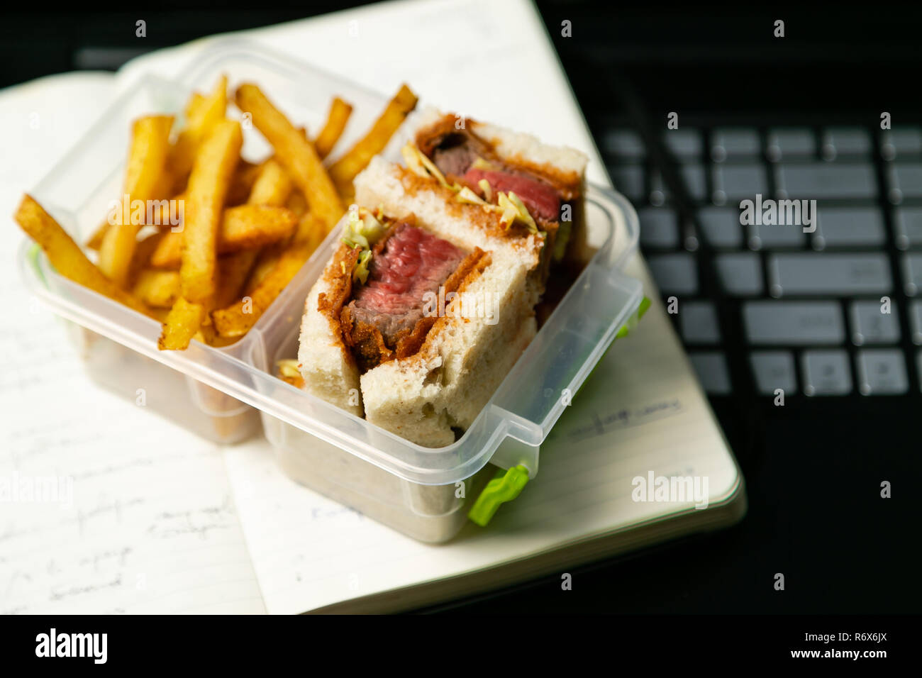 Bento at workplace with Katsu Sando food trend japanese sandwich with ...