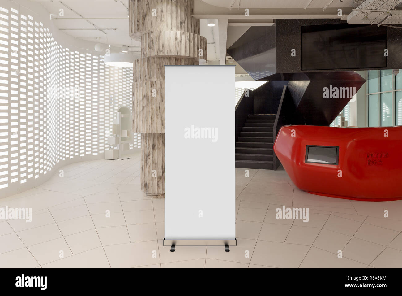 Blank roll up banner stand in office interior with reception desk and ...