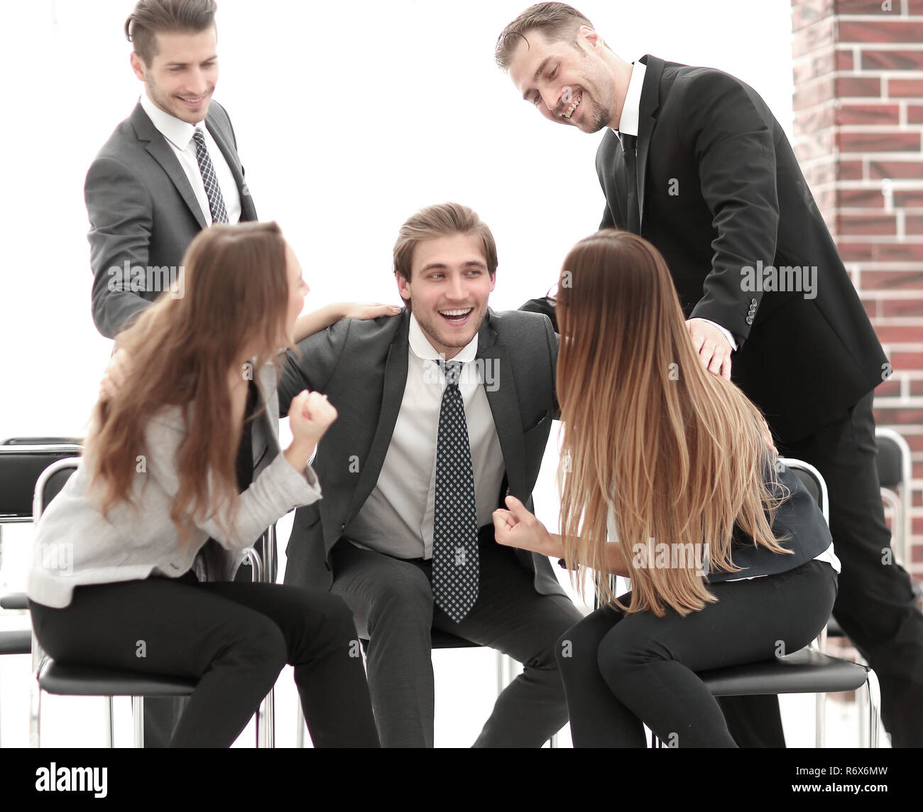 Hugging business people toasting to celebrate success Stock Photo - Alamy