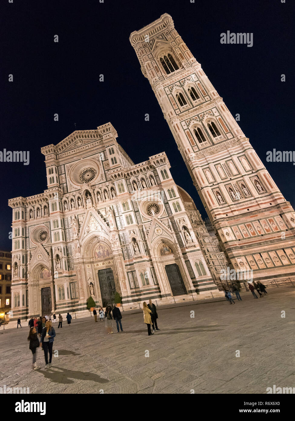 Vertical view of the Duomo and Giotto's Tower at night in Florence ...