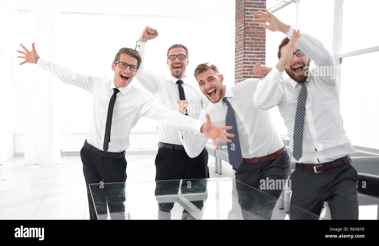 cheering business team in a modern office Stock Photo - Alamy