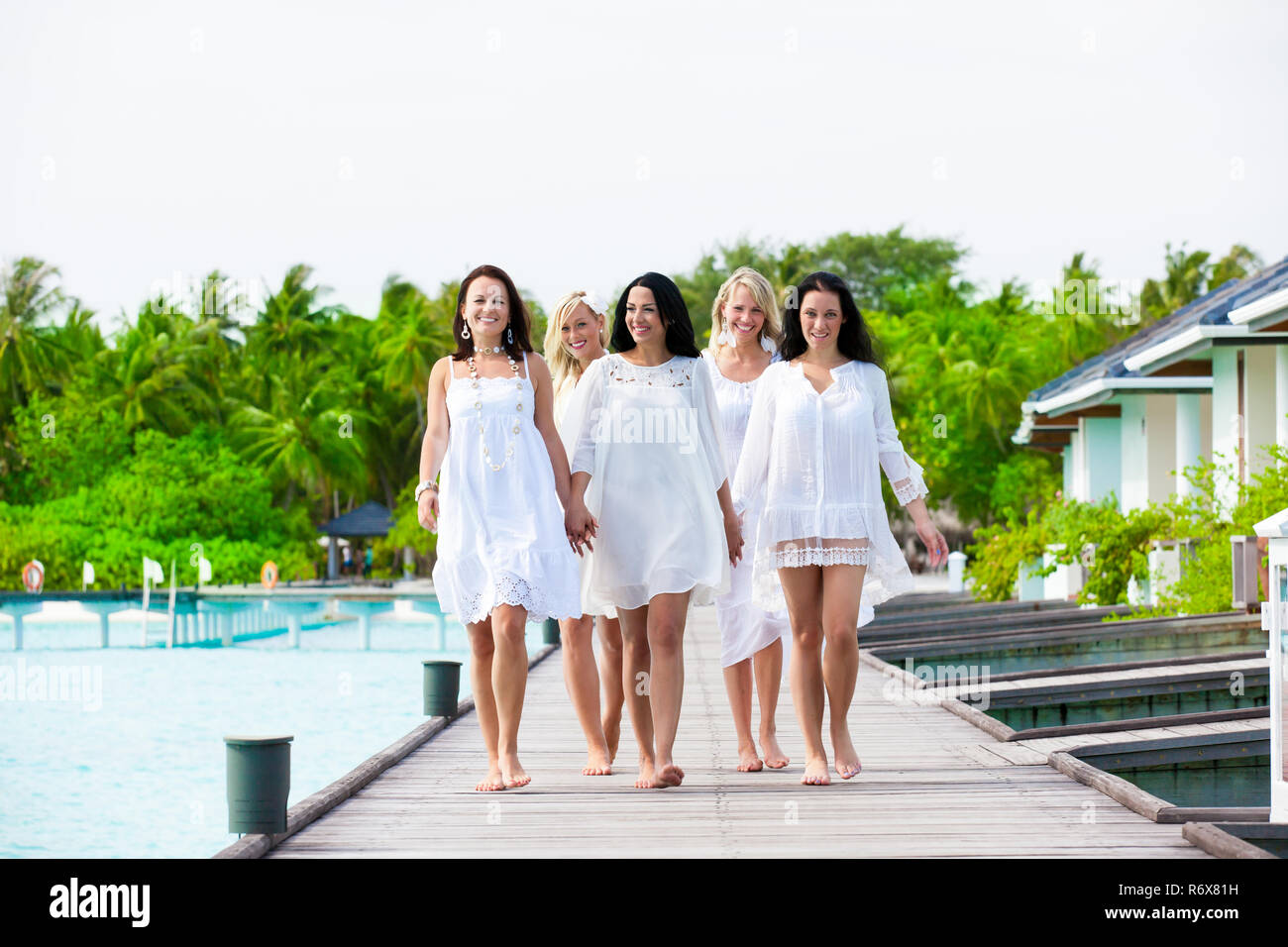 Young girl group on Maldives Stock Photo - Alamy